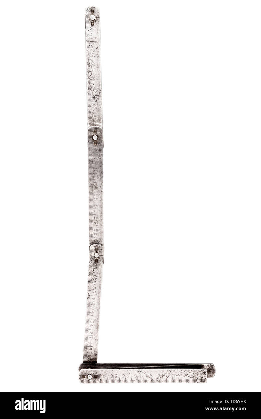 Old iron meter ruler. Old iron folding meter in the shape of letter A ...