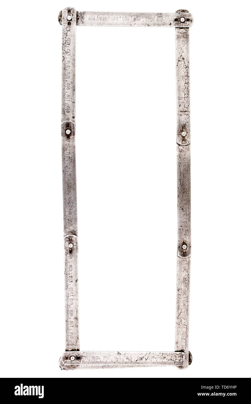 Old iron meter ruler. Old iron folding meter in the shape of letter O ...