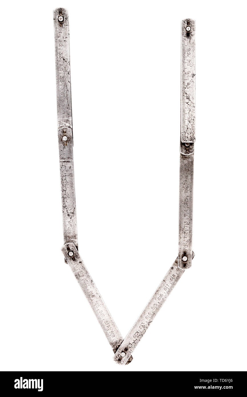 Old iron meter ruler. Old iron folding meter in the shape of letter V ...