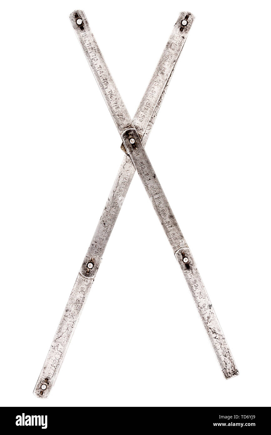 Old iron meter ruler. Old iron folding meter in the shape of letter X ...
