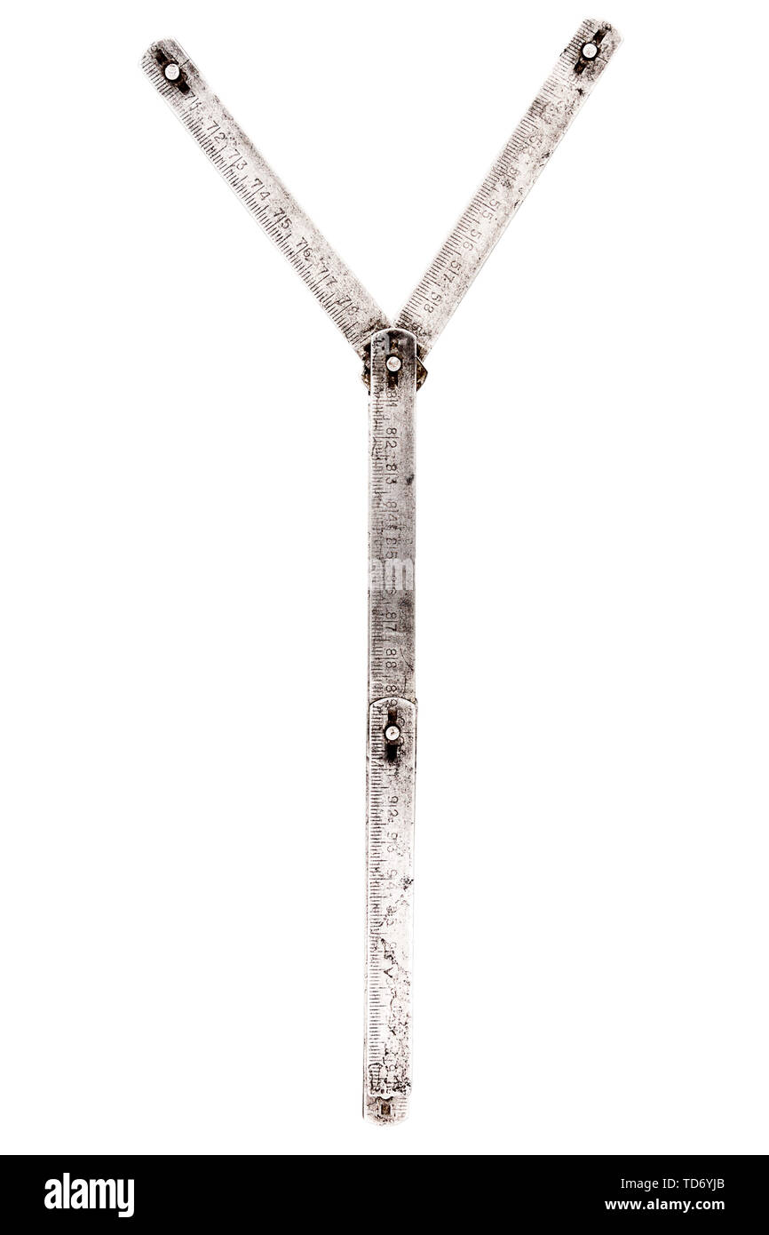 Old iron meter ruler. Old iron folding meter in the shape of letter Y ...