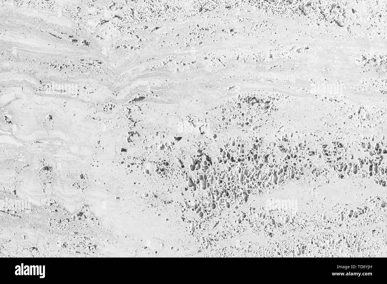 Closeup of light grey and white porous stone textured wall. Neutral ...