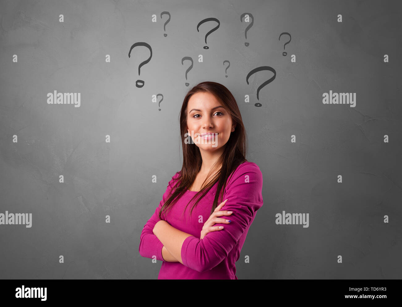 Person with question marks around face Stock Photo - Alamy