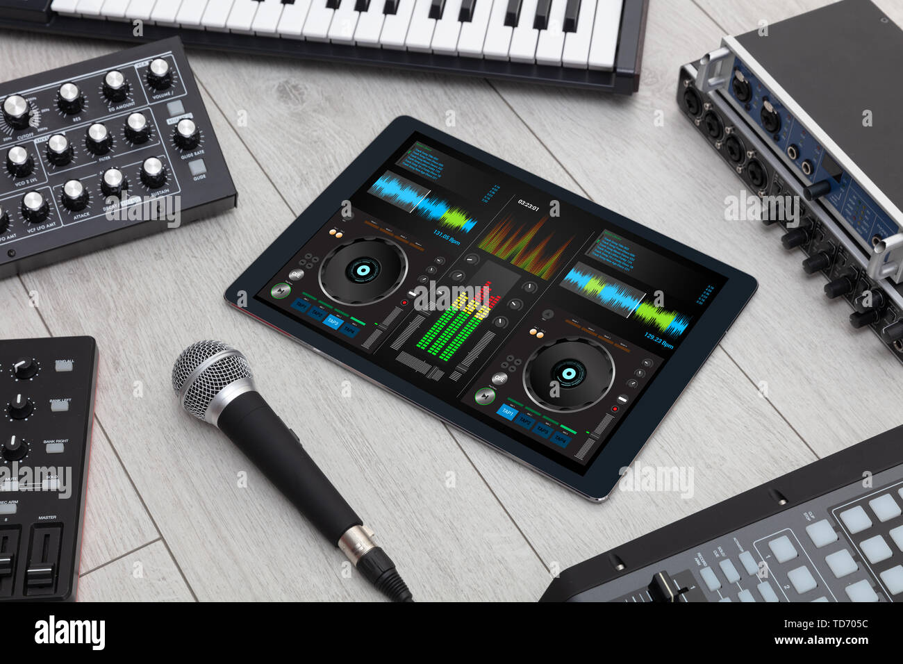 Mixing music on tablet with electronic music instruments concept Stock ...