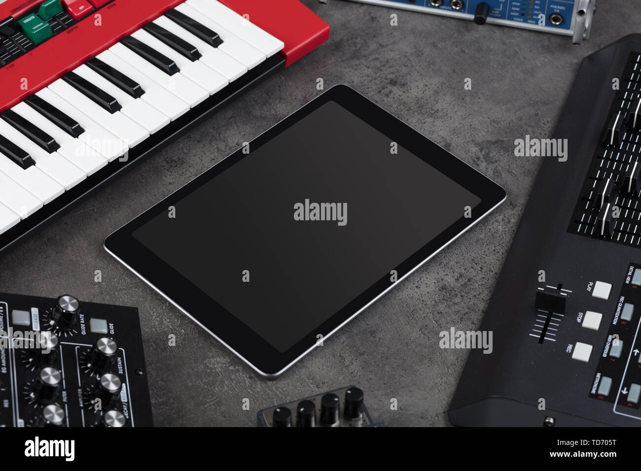 Empty tablet and electronic music instruments Stock Photo - Alamy