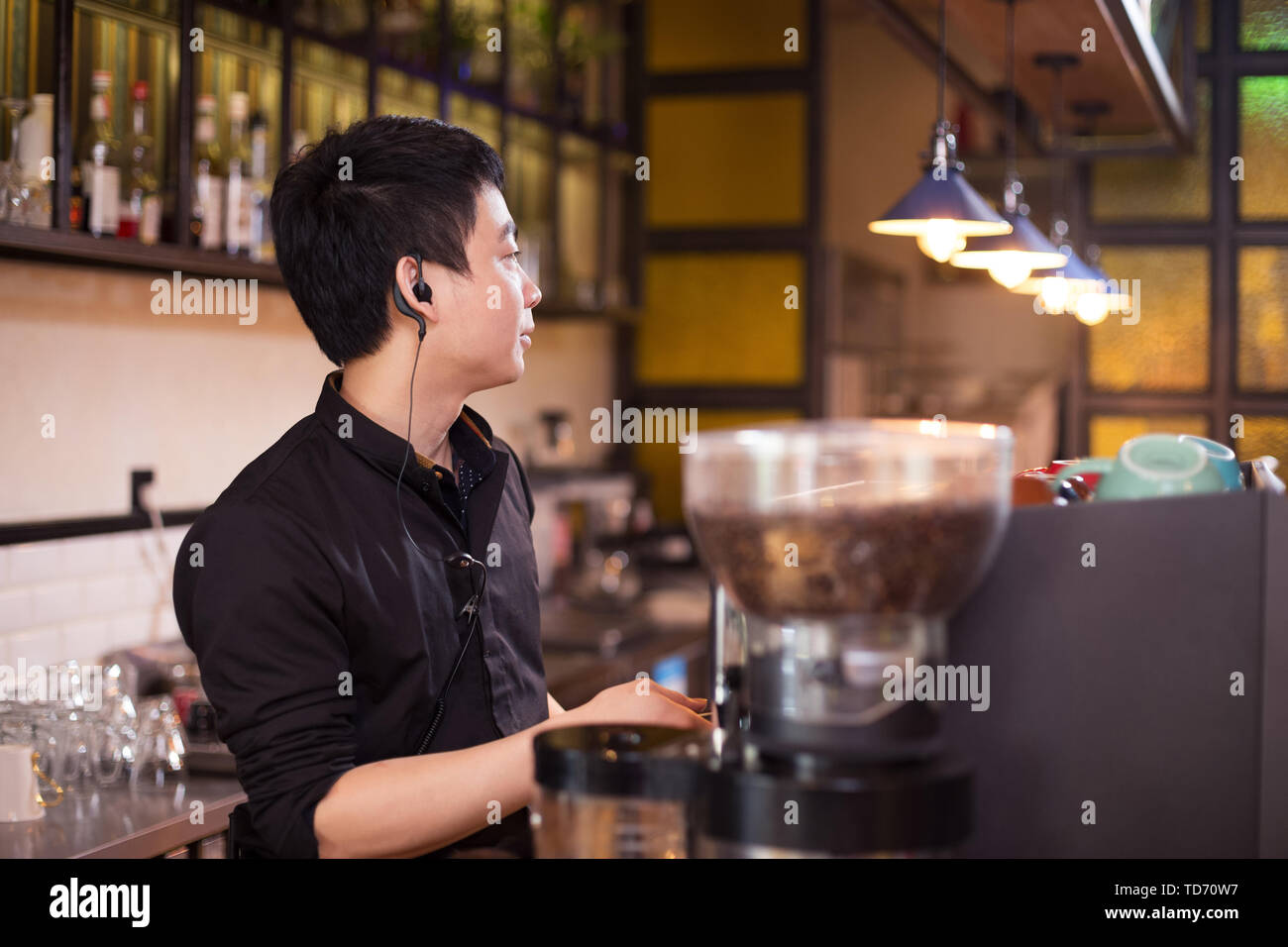waiter serving in modern cafe Stock Photo - Alamy