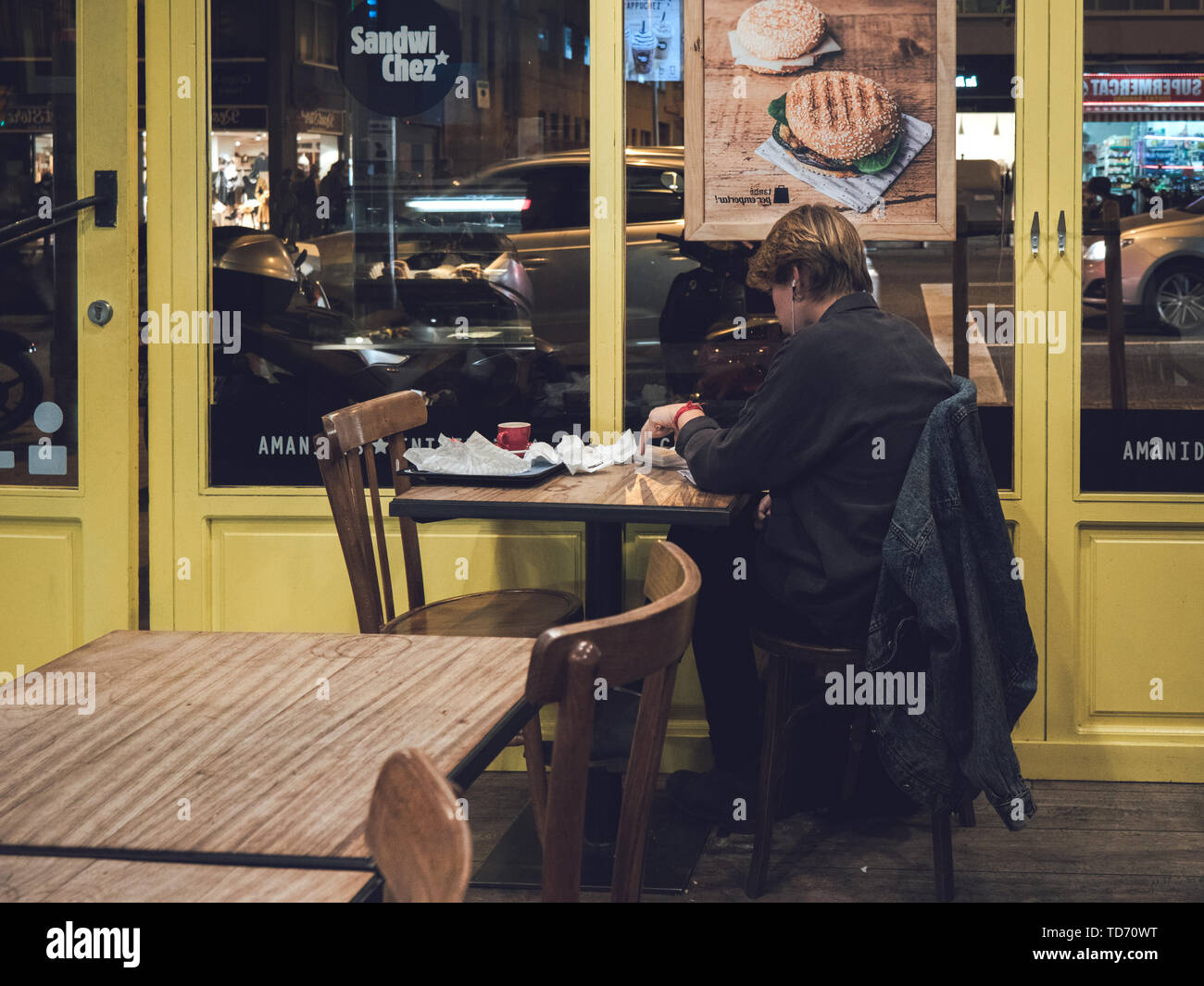 Barcelona, Spain - Nov 14, 2017: Single young woman eating inside ...