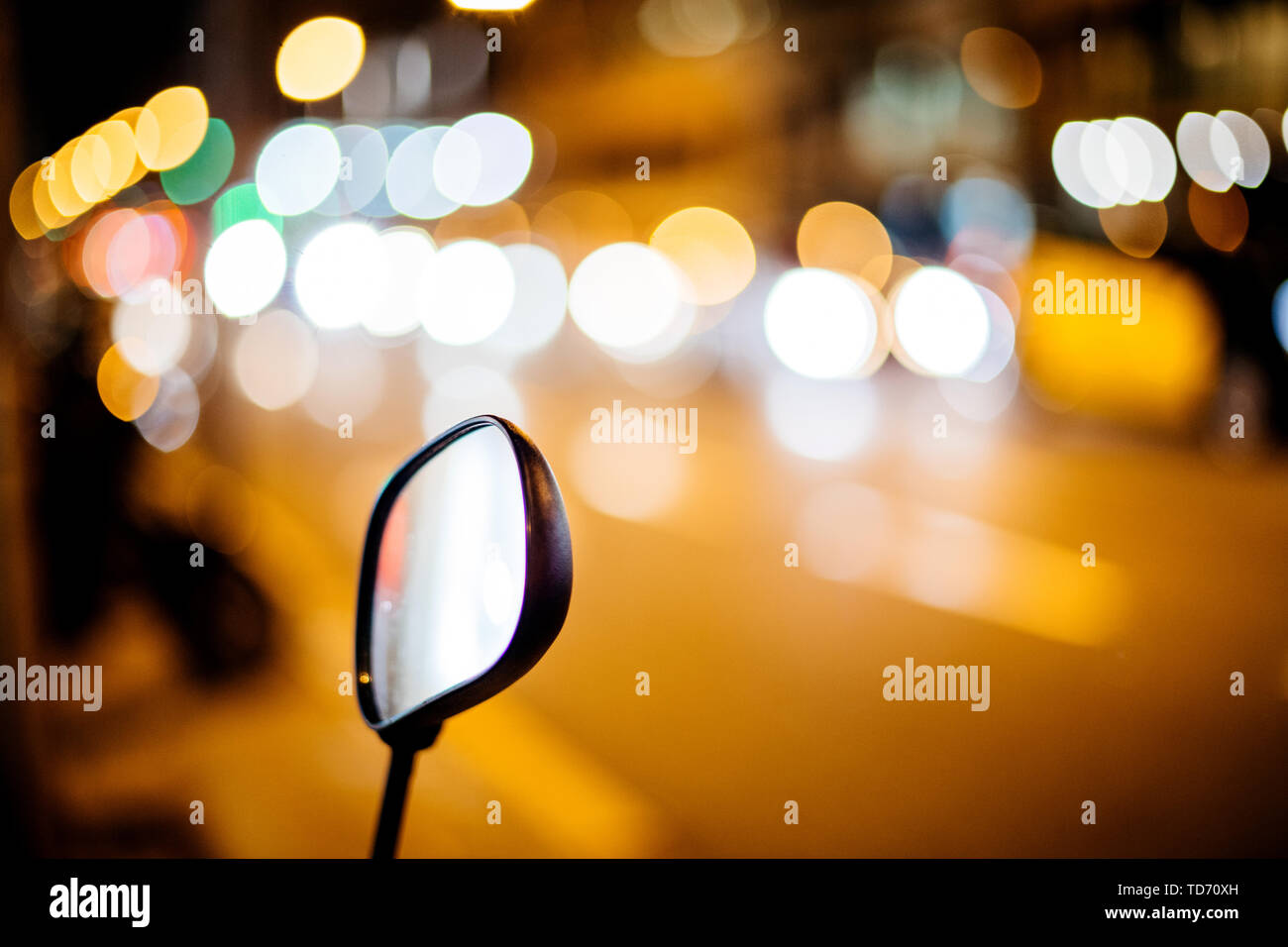 Beautiful bokeh of the city street with motorcycle moped rear view ...
