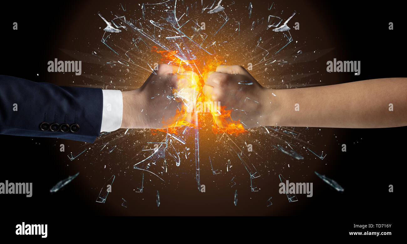 Two hands fighting and breaking a glass into small pieces Stock Photo ...