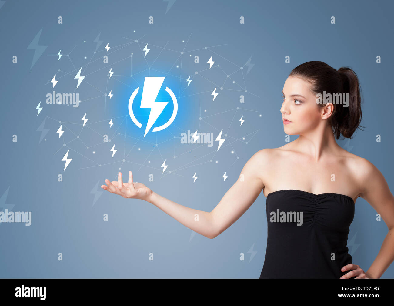 Young smiling person presenting battery life concept Stock Photo - Alamy
