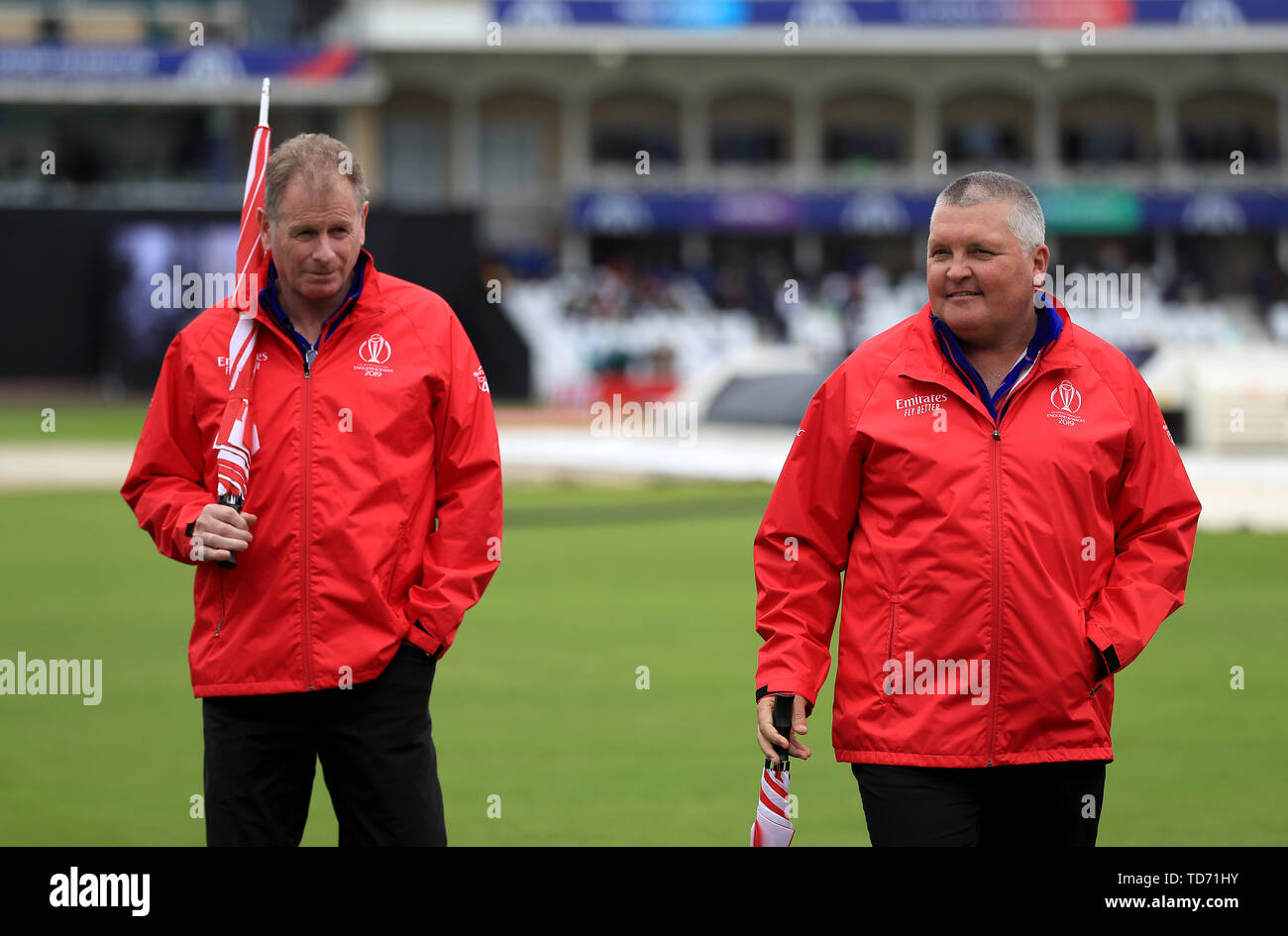 Match umpires Paul Reiffel (left) and Marais Erasmus inspect the pitch ...