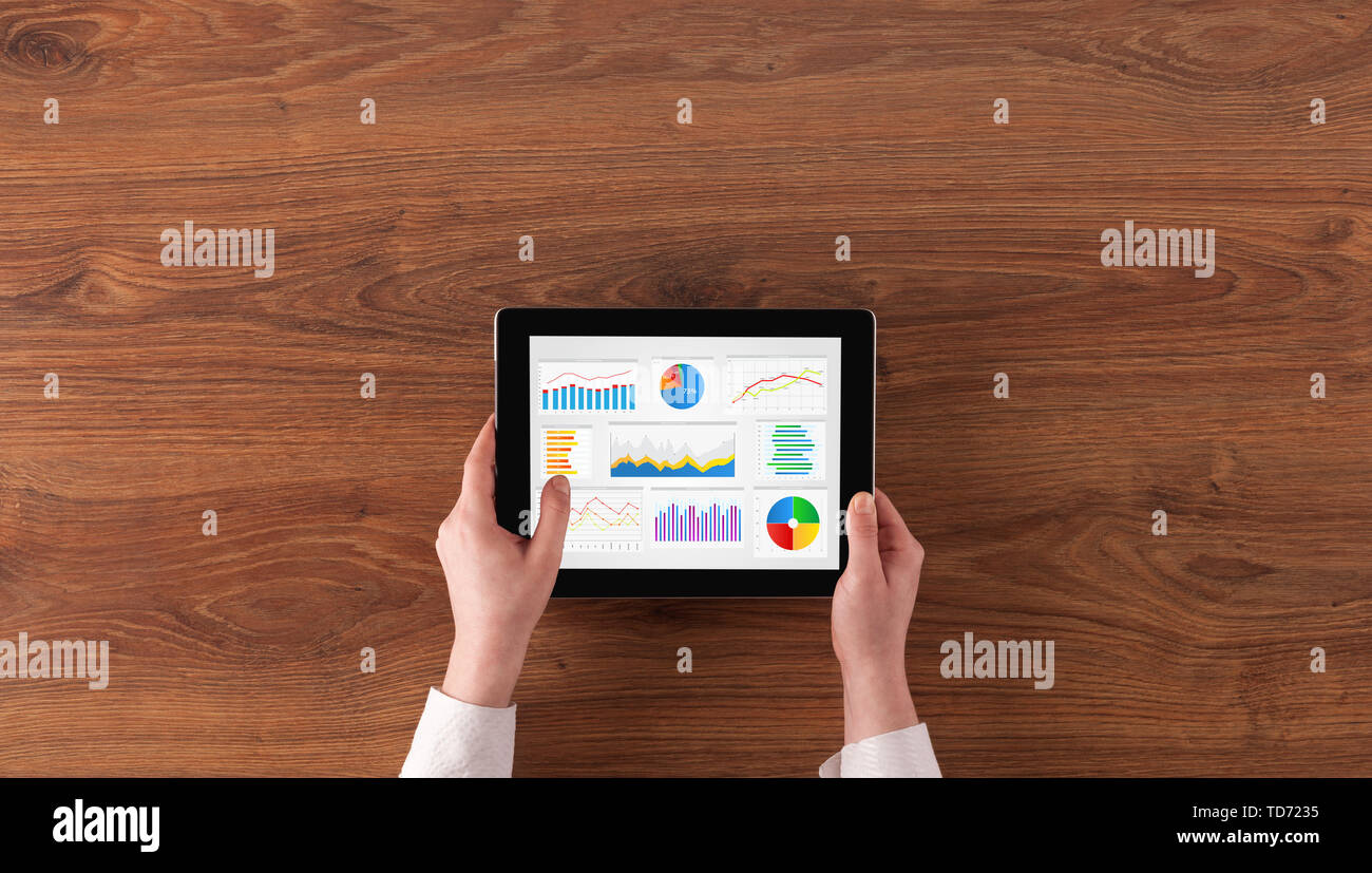 Hand making diagrams and charts on tablet Stock Photo - Alamy