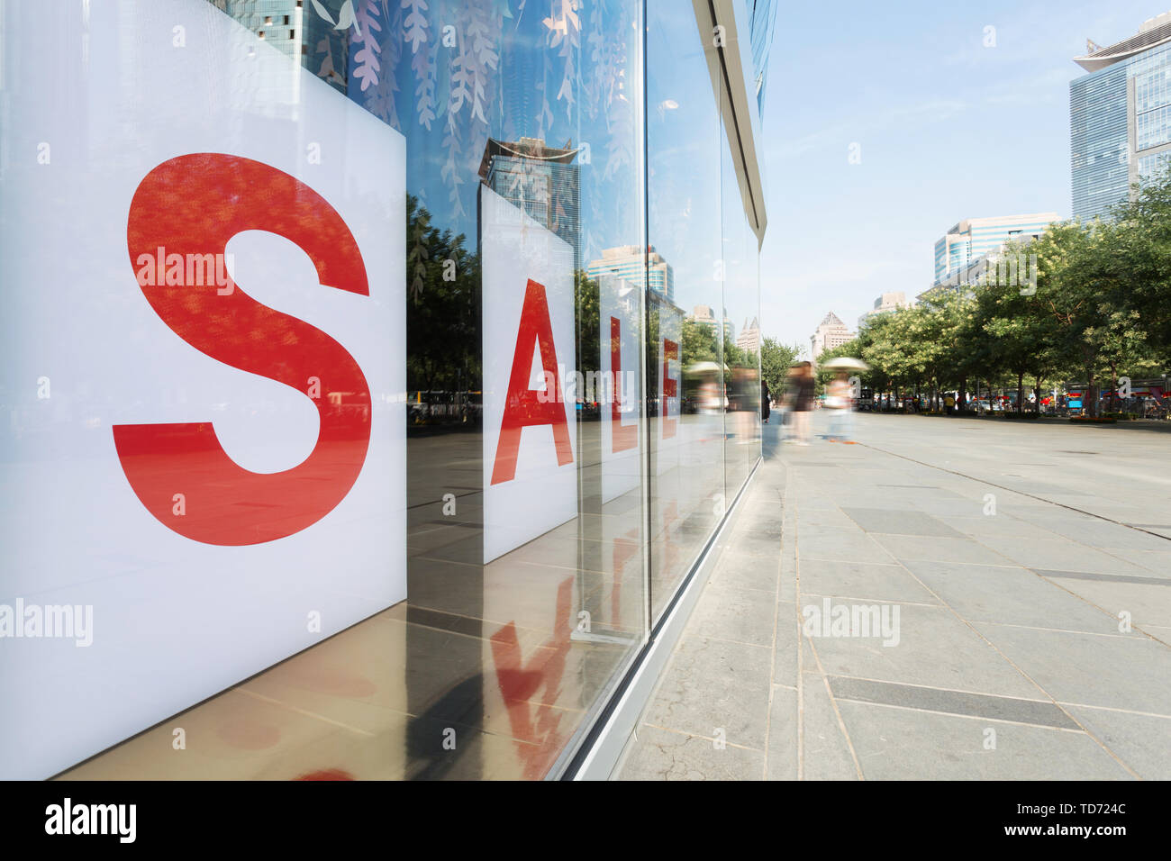 Sale poster in shop window Stock Photo - Alamy