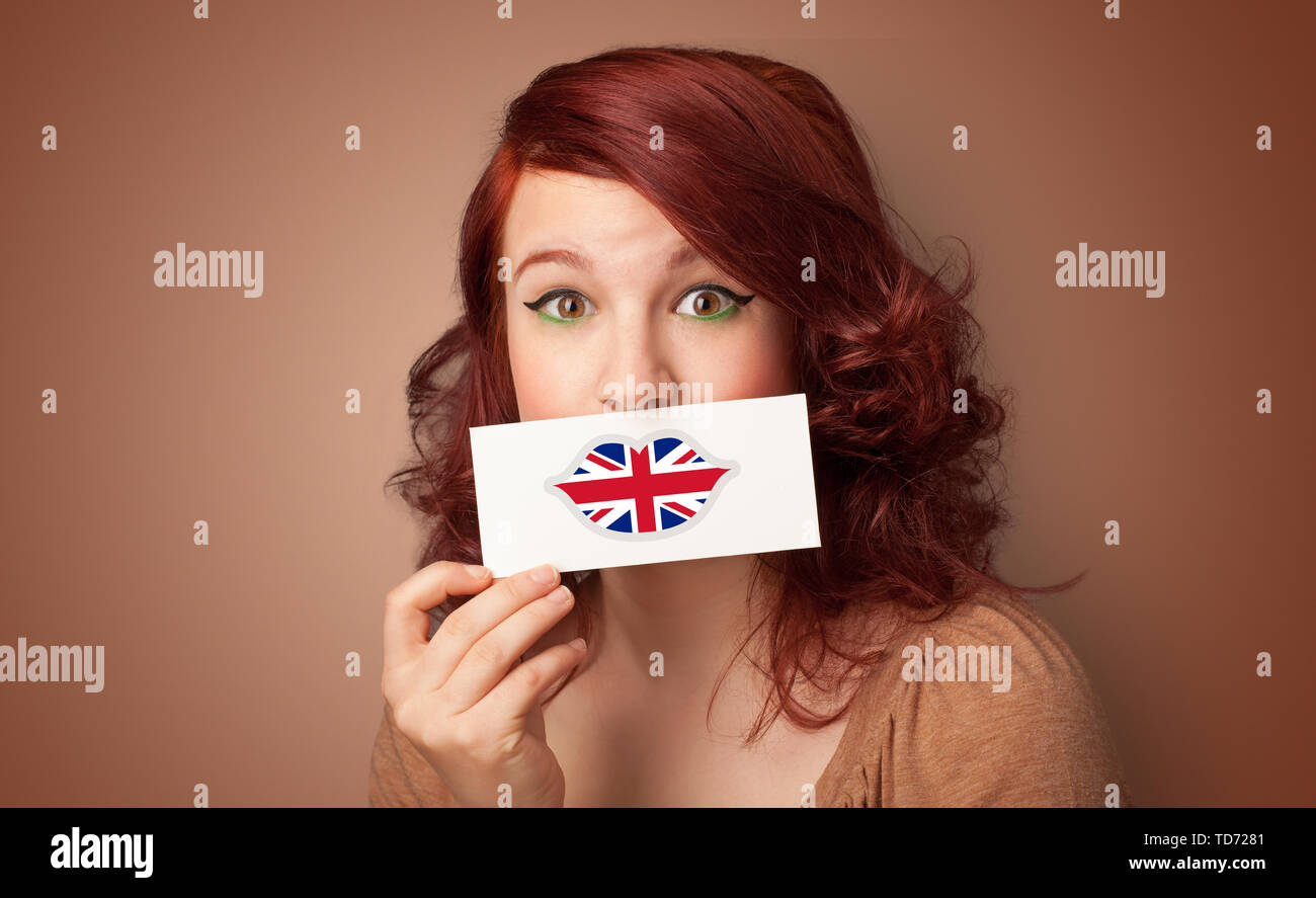 Person holding UK flag lips shape card Stock Photo - Alamy