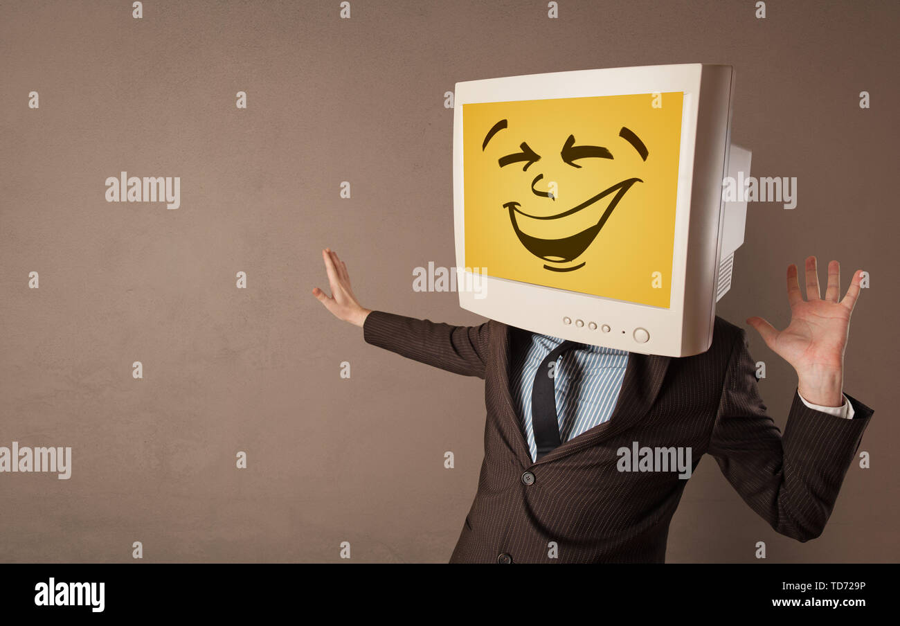 Young person with happy smiley monitor head Stock Photo - Alamy