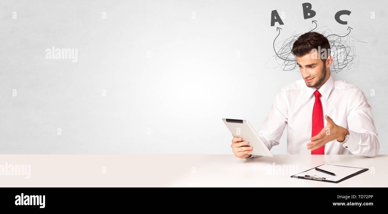 Handsome man teaching abc in classroom Stock Photo - Alamy