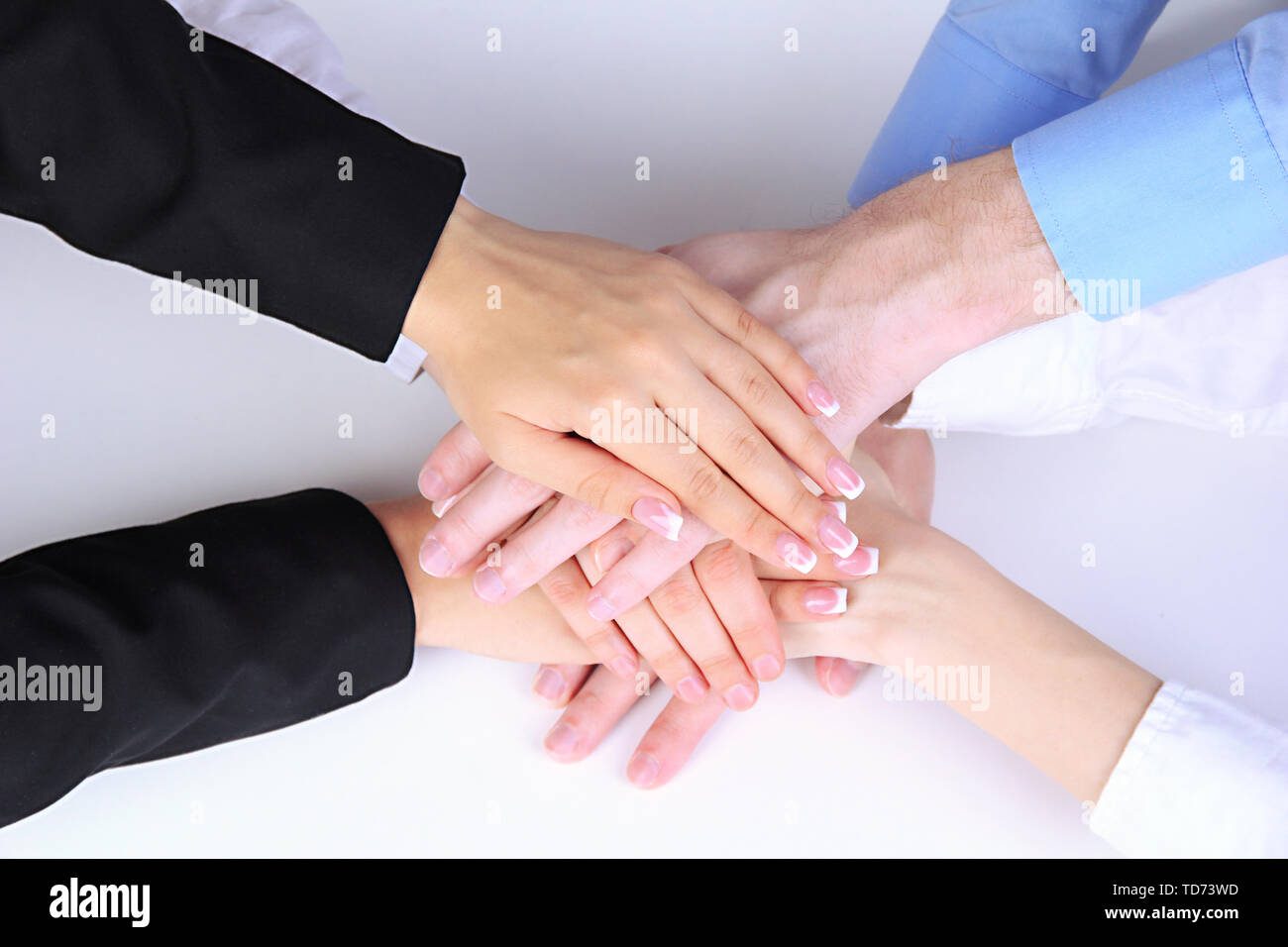 Group of young people's hands isolated on white Stock Photo - Alamy