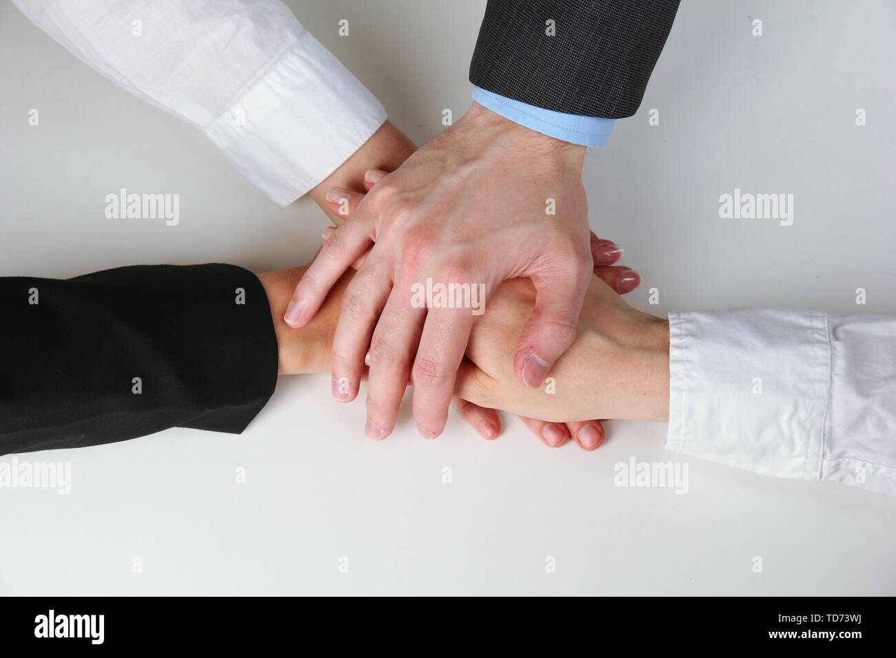 Group of young people's hands isolated on white Stock Photo - Alamy
