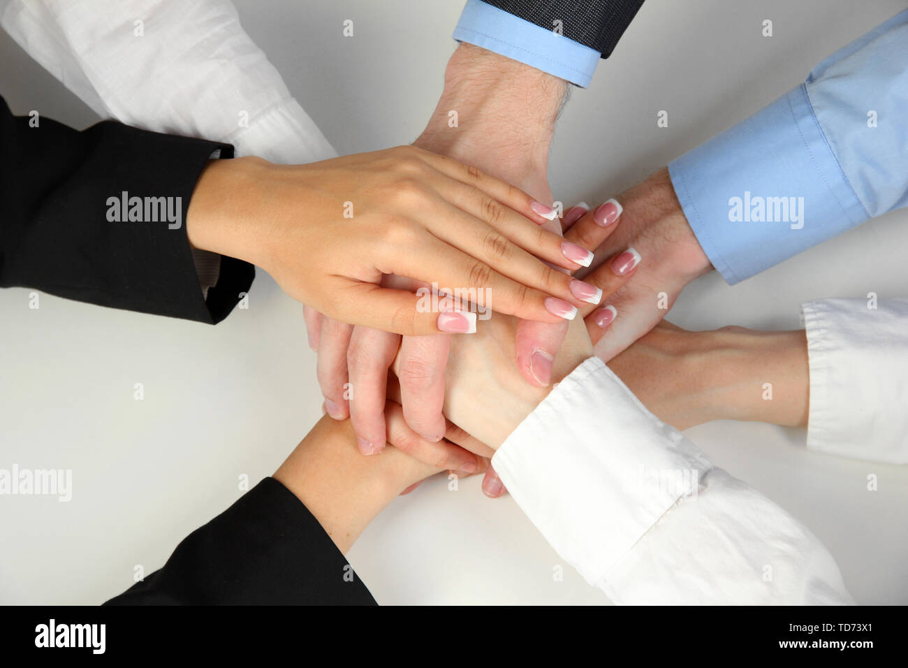 Group of young people's hands isolated on white Stock Photo - Alamy