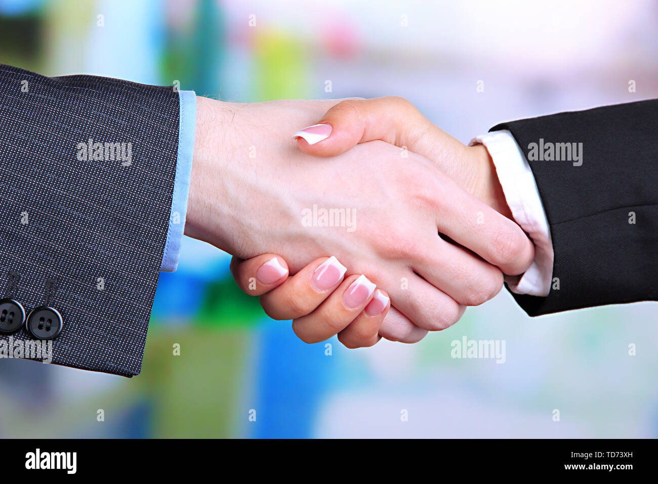 Business handshake on bright background Stock Photo - Alamy