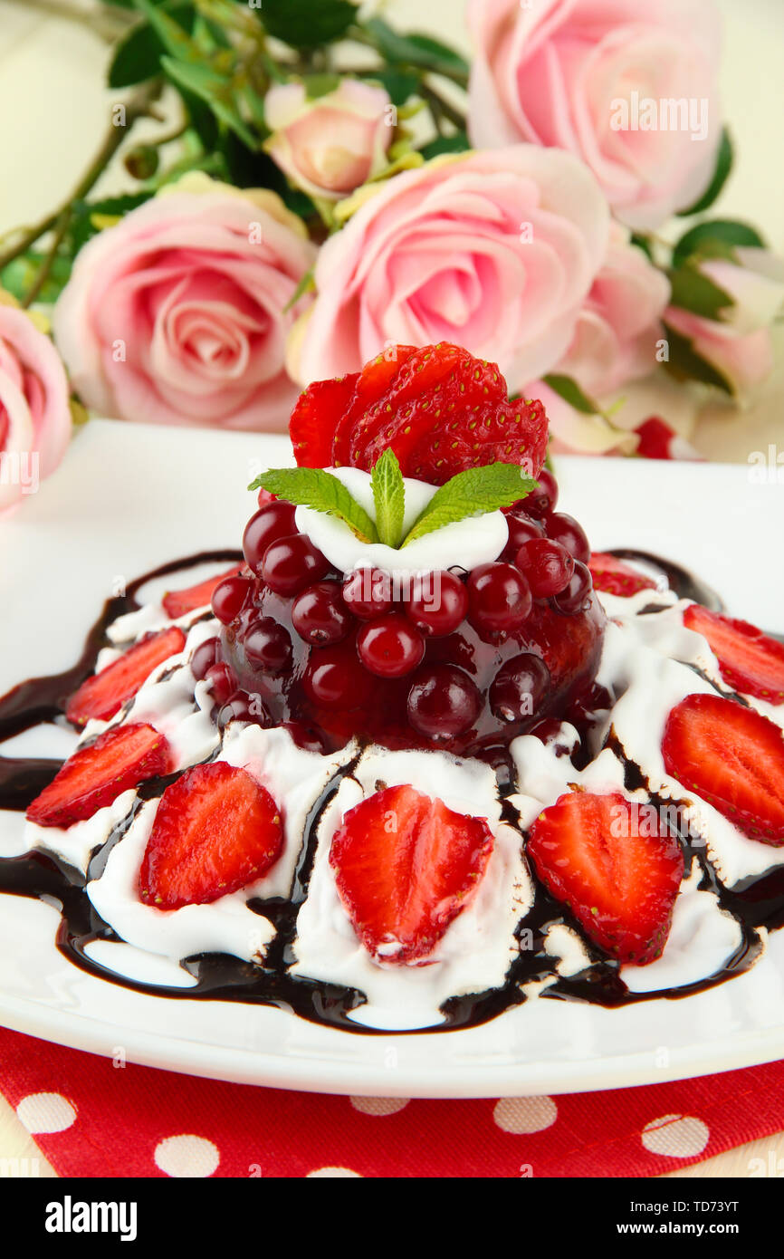 Tasty jelly dessert with fresh berries, on pink roses background Stock ...