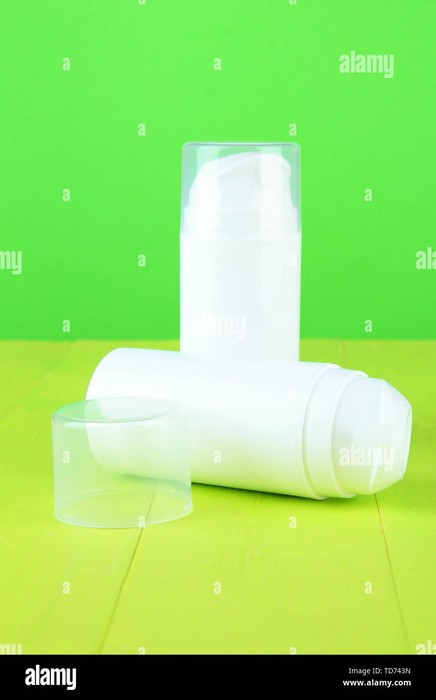 Bottle with cream, on color background Stock Photo - Alamy