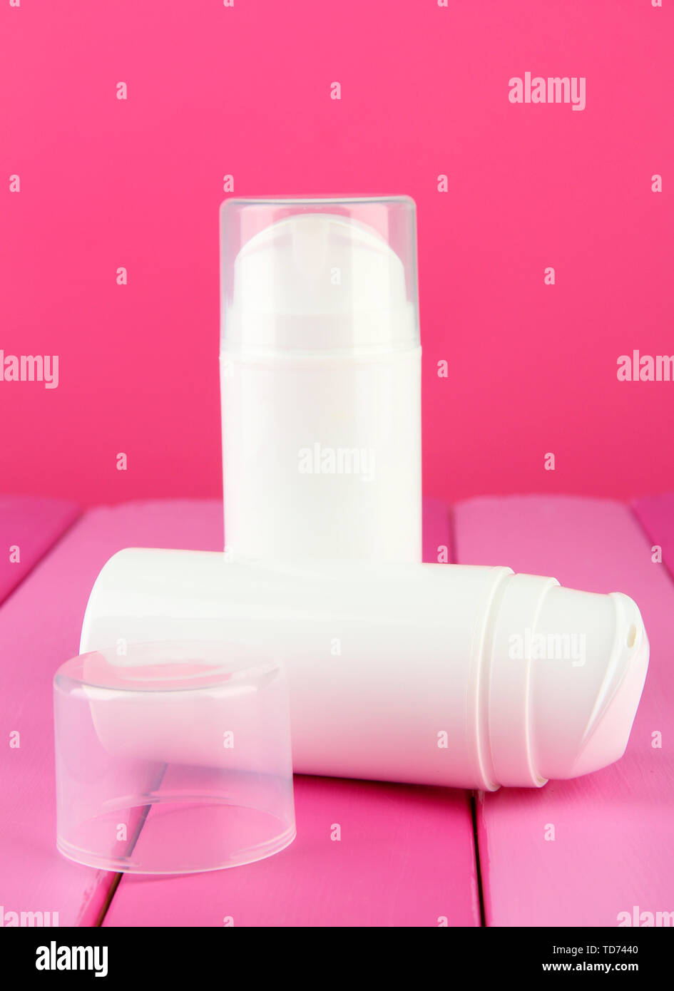 Bottle with cream, on color background Stock Photo - Alamy