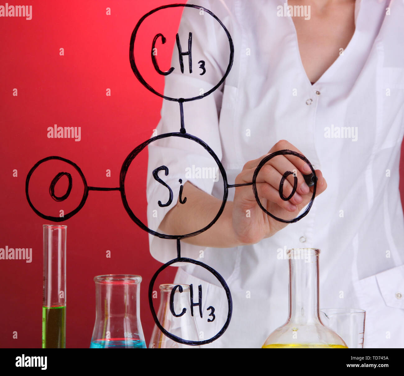 Female chemist writing on hi-res stock photography and images - Alamy