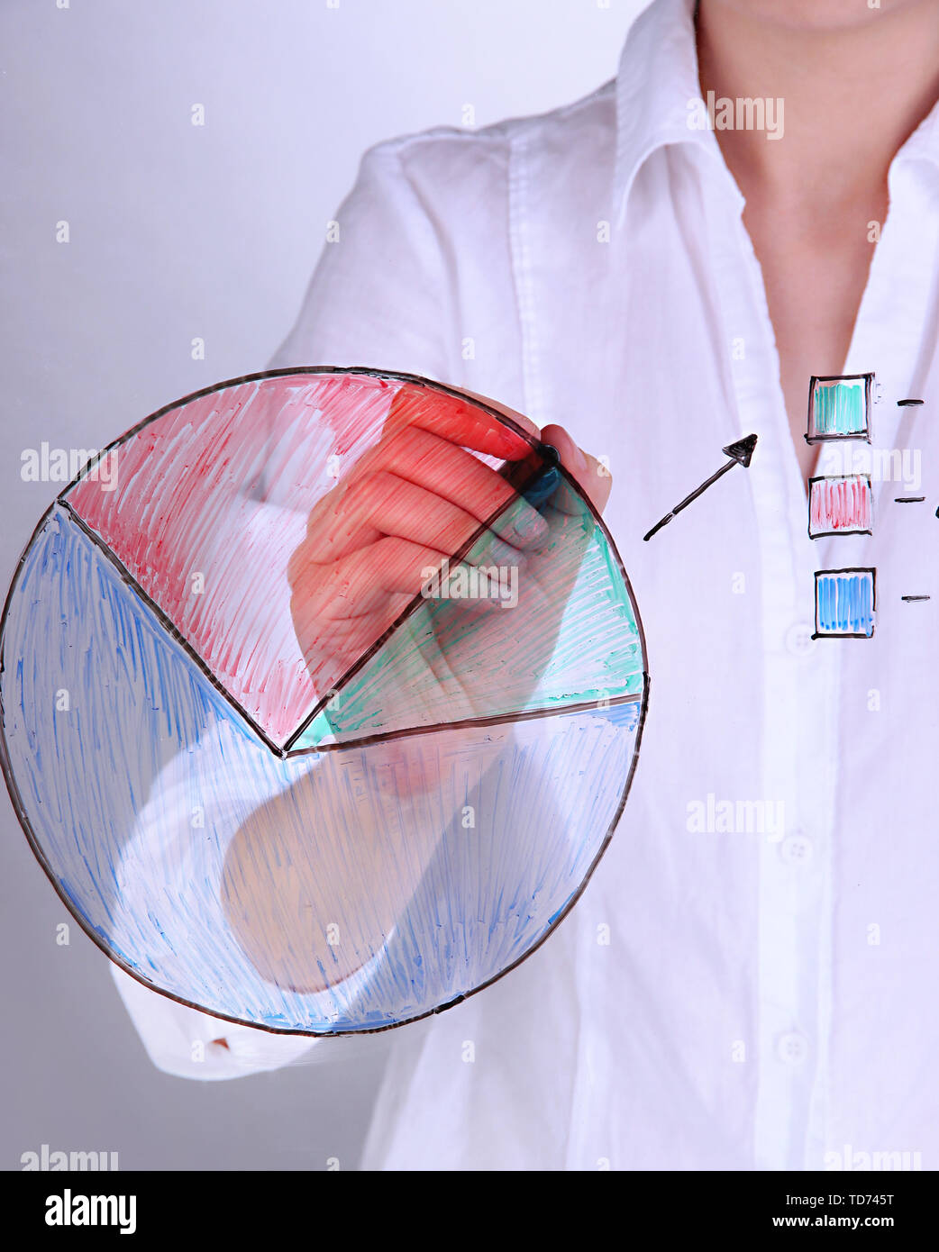 Woman paints graphic on glass on grey background Stock Photo - Alamy