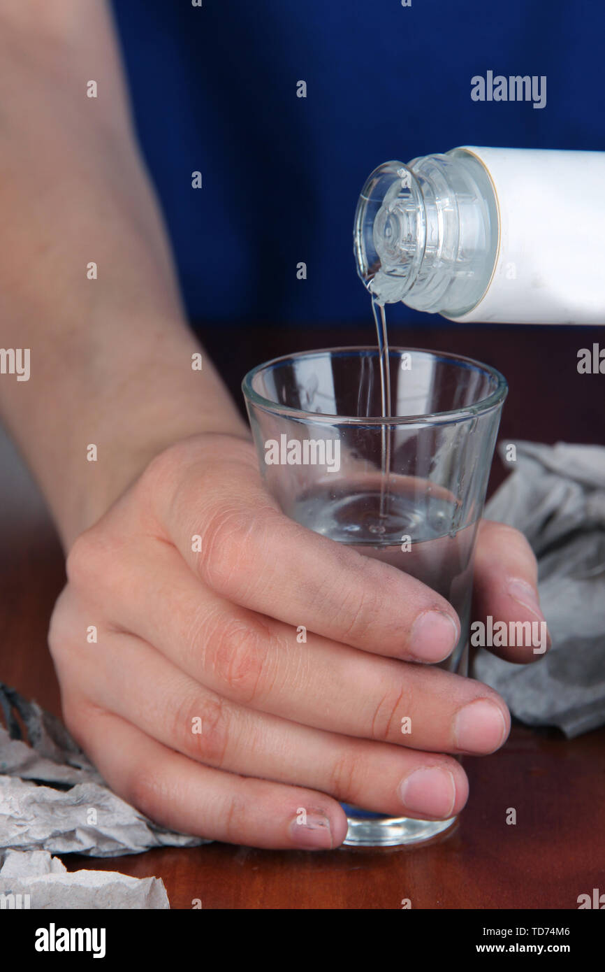 Drunk man drinks vodka at table close-up Stock Photo - Alamy