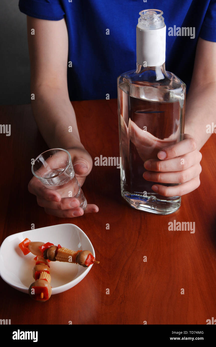 Drunk man drinks vodka at table close-up Stock Photo - Alamy