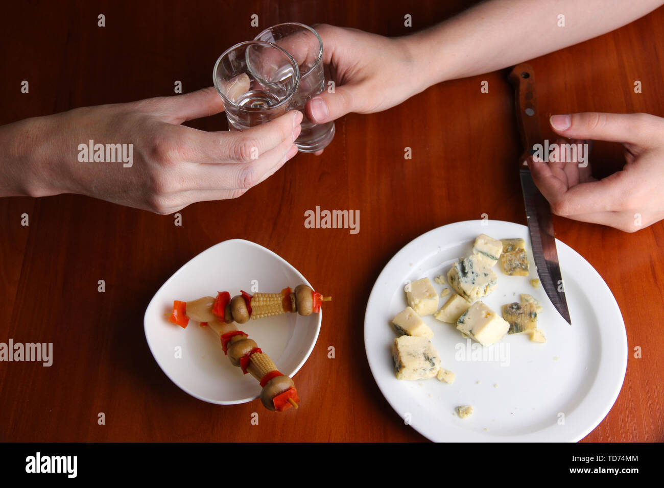 Drunk mans drinks vodka at table close-up Stock Photo - Alamy