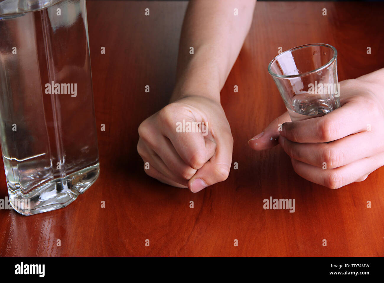 Drunk man drinks vodka at table close-up Stock Photo - Alamy
