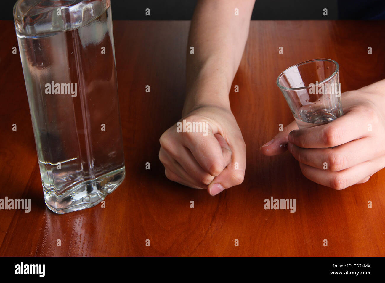 Drunk man drinks vodka at table close-up Stock Photo - Alamy