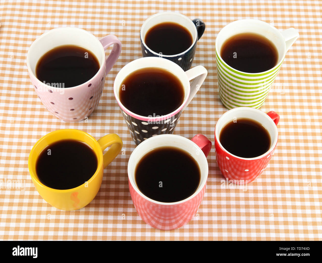 Many cups of coffee on checkered napkin Stock Photo - Alamy