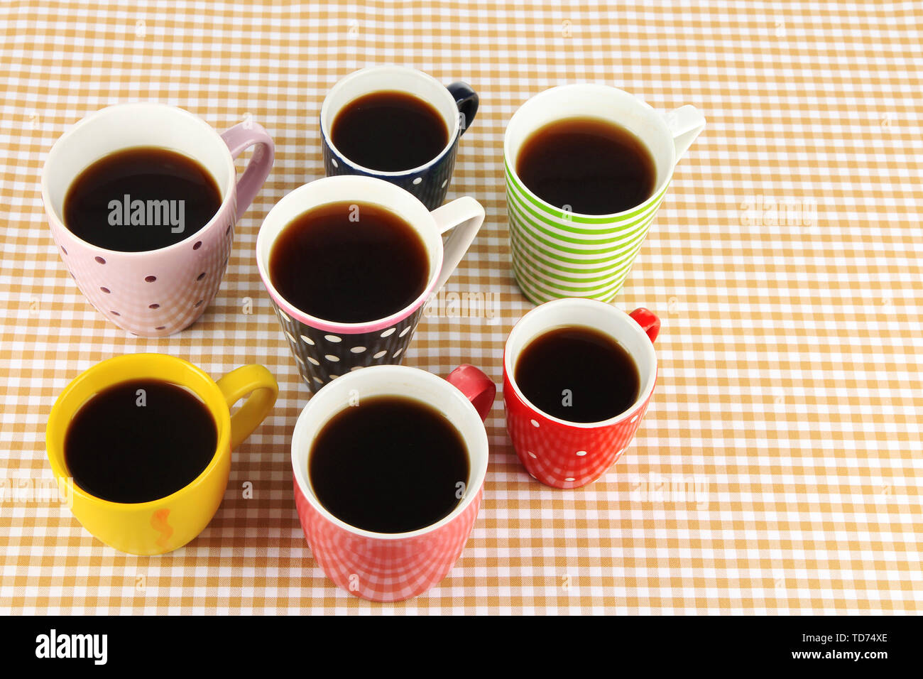 Many cups of coffee on checkered napkin Stock Photo - Alamy