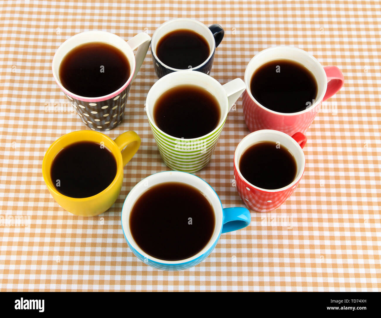 Many cups of coffee on checkered napkin Stock Photo - Alamy