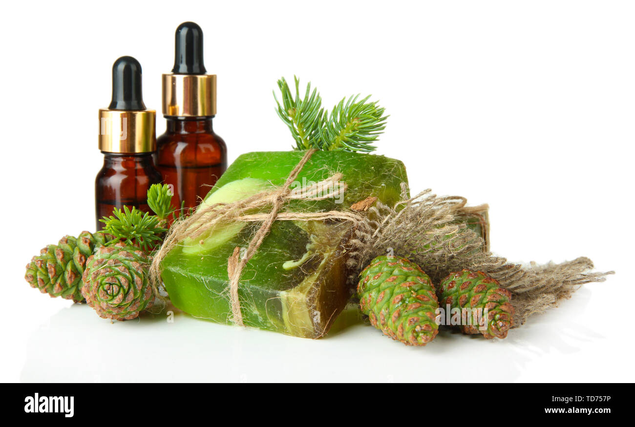 Hand-made soap and bottles of fir tree oil, isolated on white Stock ...