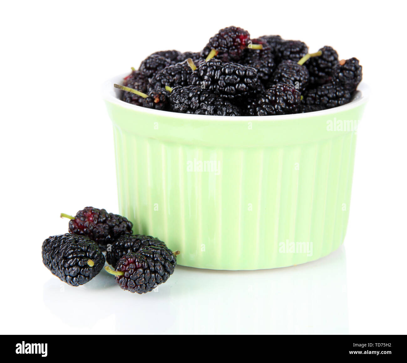 Ripe mulberries in bowl isolated on white Stock Photo - Alamy
