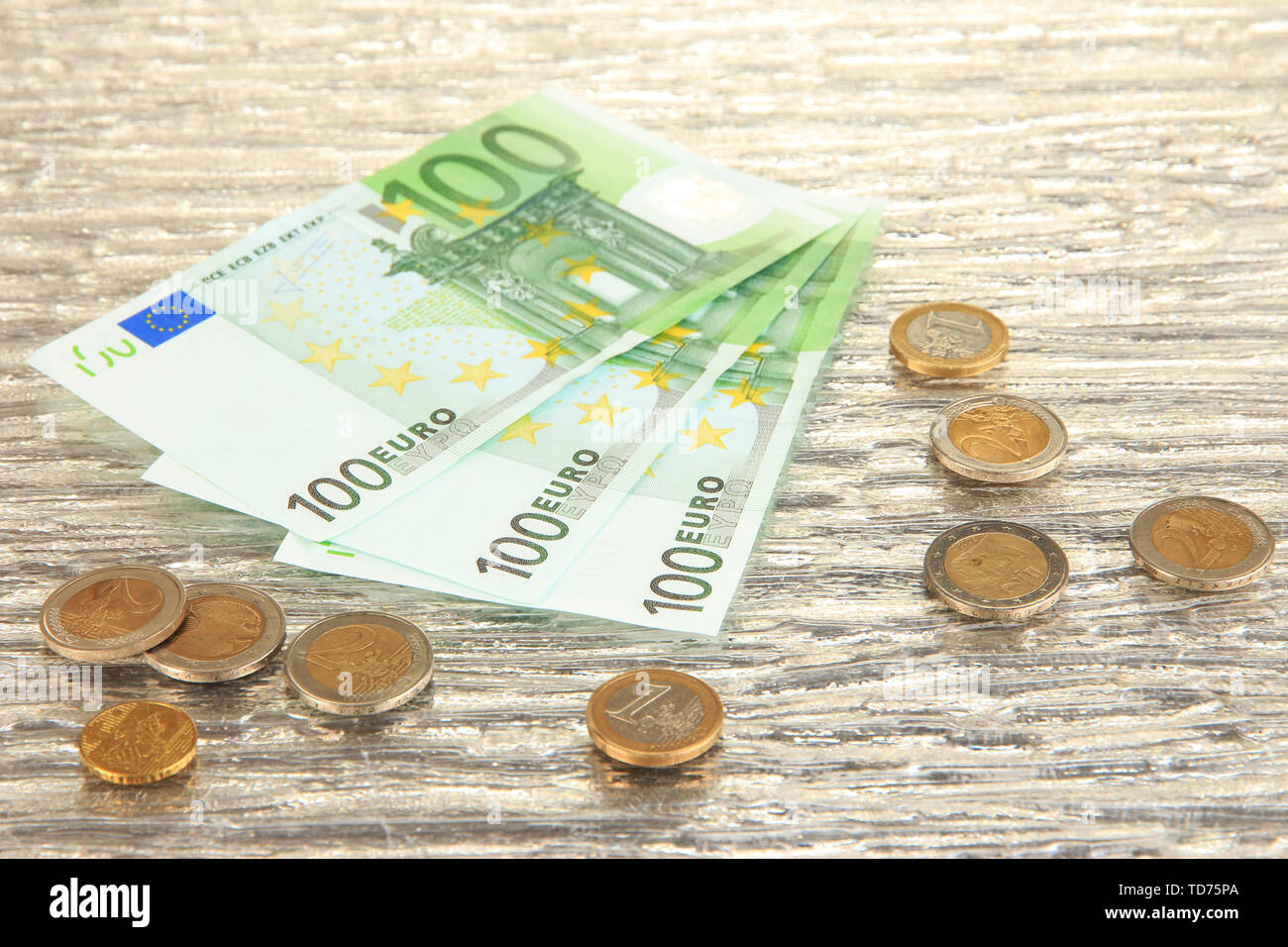 Euro banknotes and euro cents on grey glass background Stock Photo - Alamy