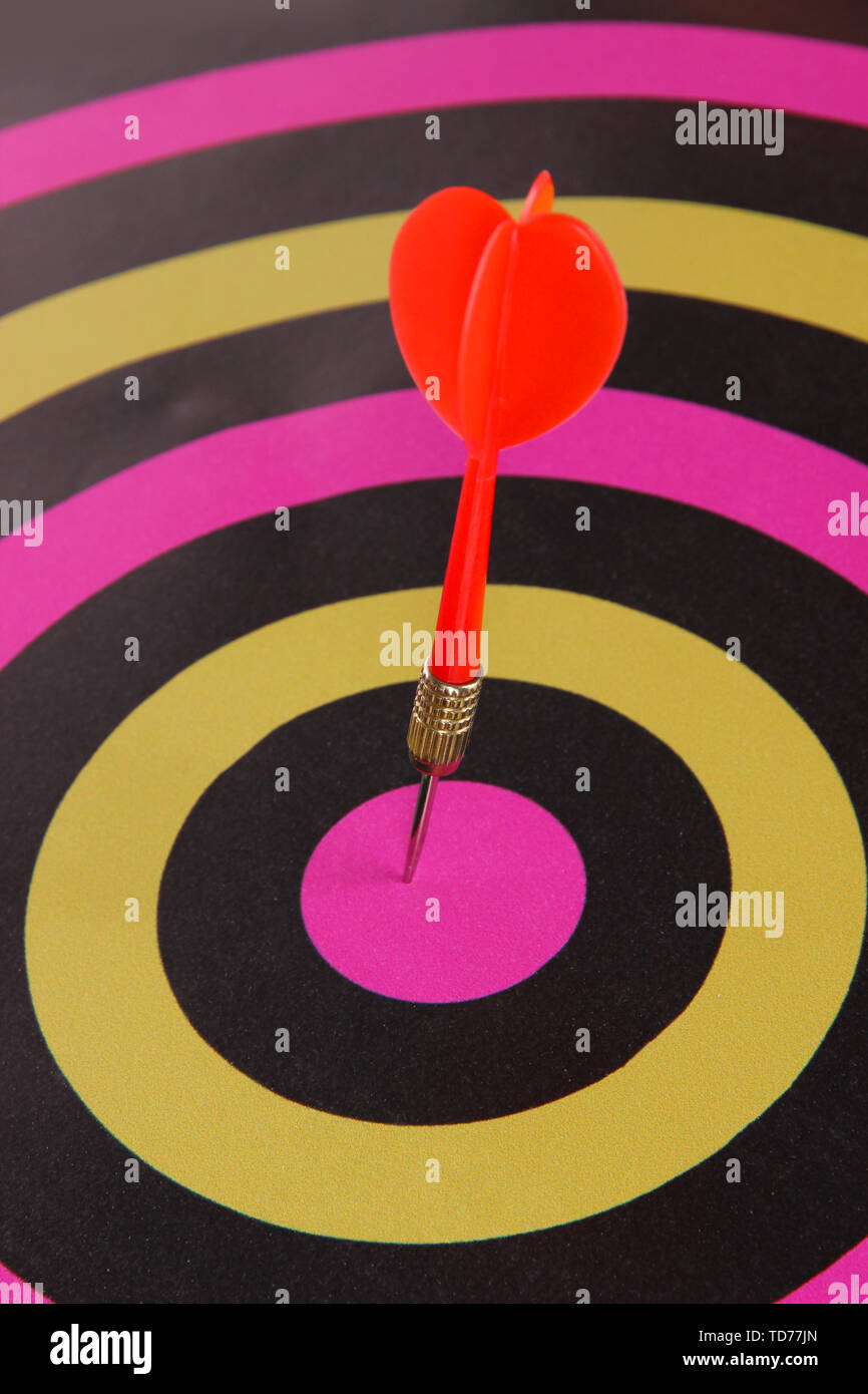 Target with dart close-up Stock Photo - Alamy