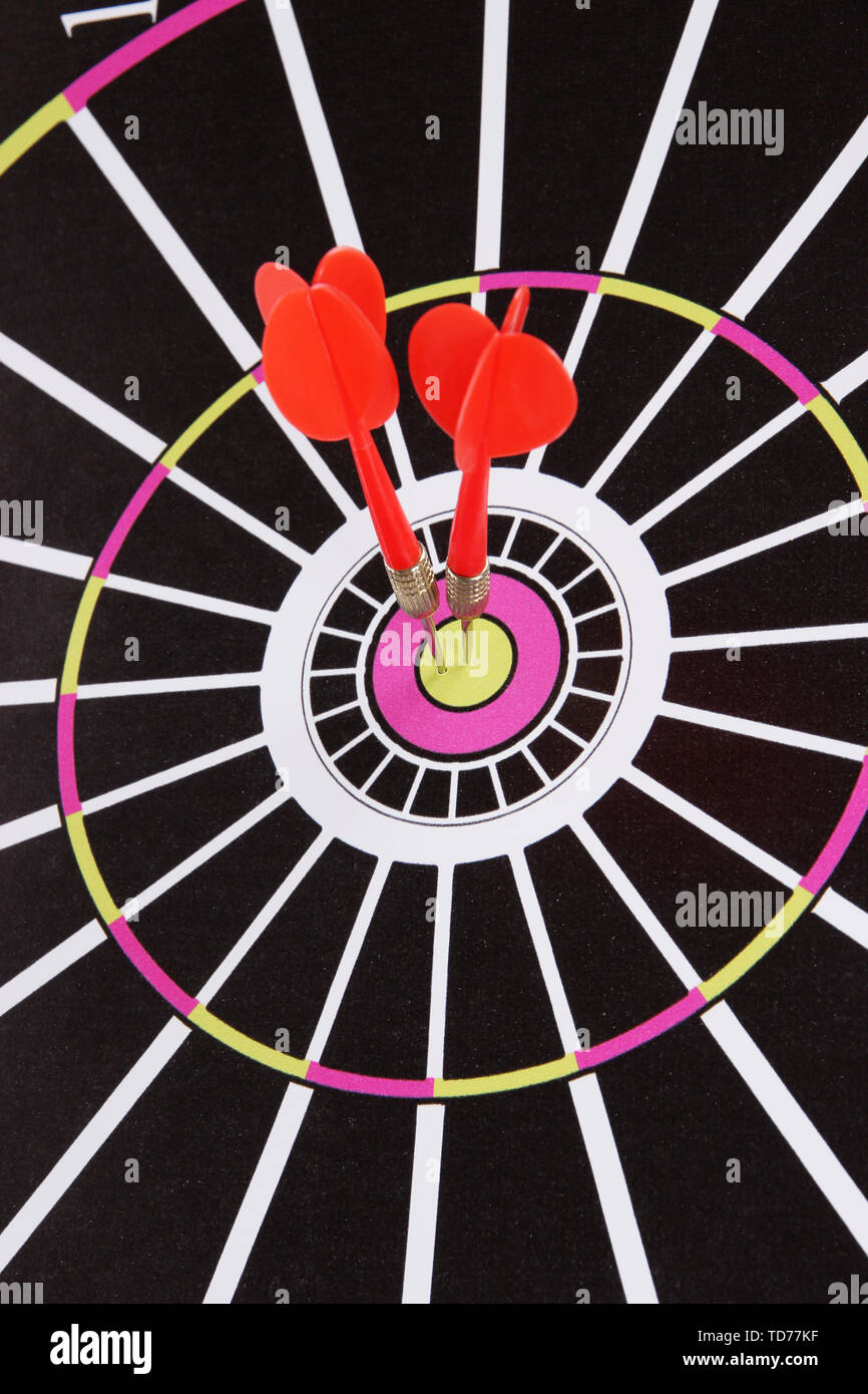Target with darts close-up Stock Photo - Alamy