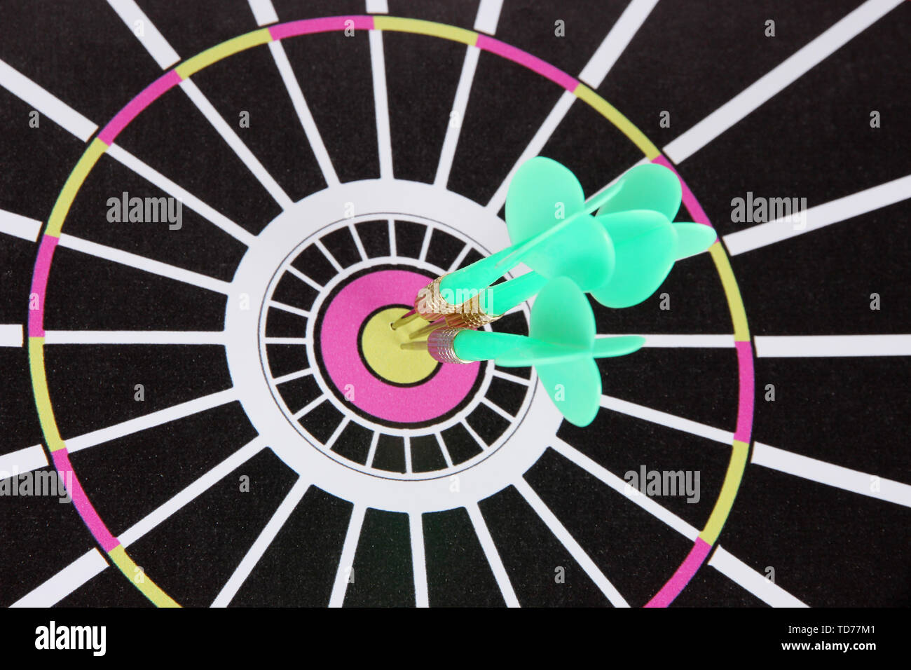 Target with darts close-up Stock Photo - Alamy