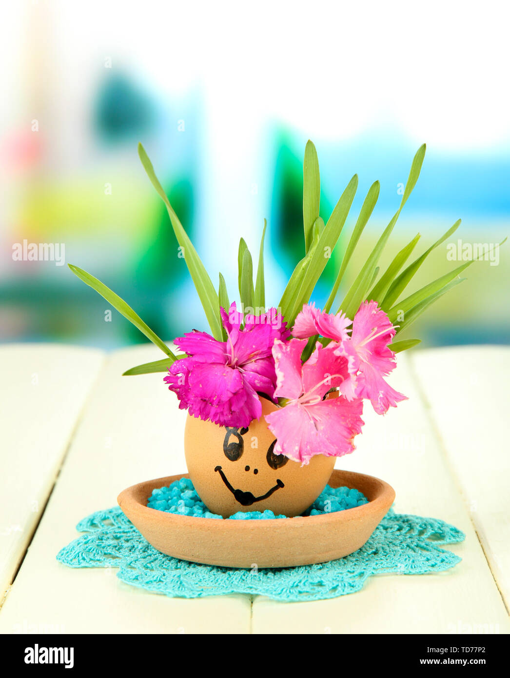 Flowers growing from egg shell, on bright background Stock Photo - Alamy