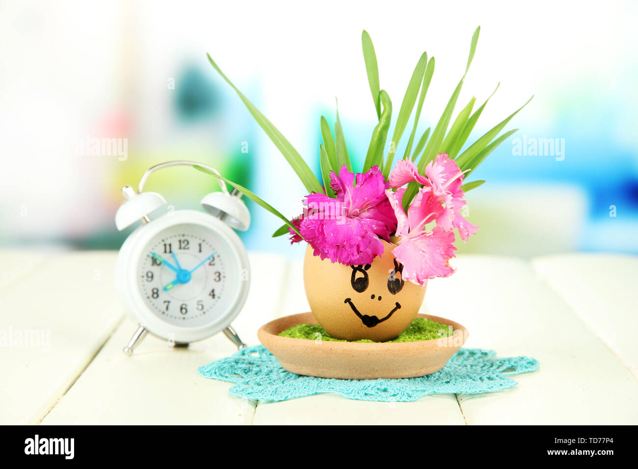Flowers growing from egg shell, on bright background Stock Photo - Alamy