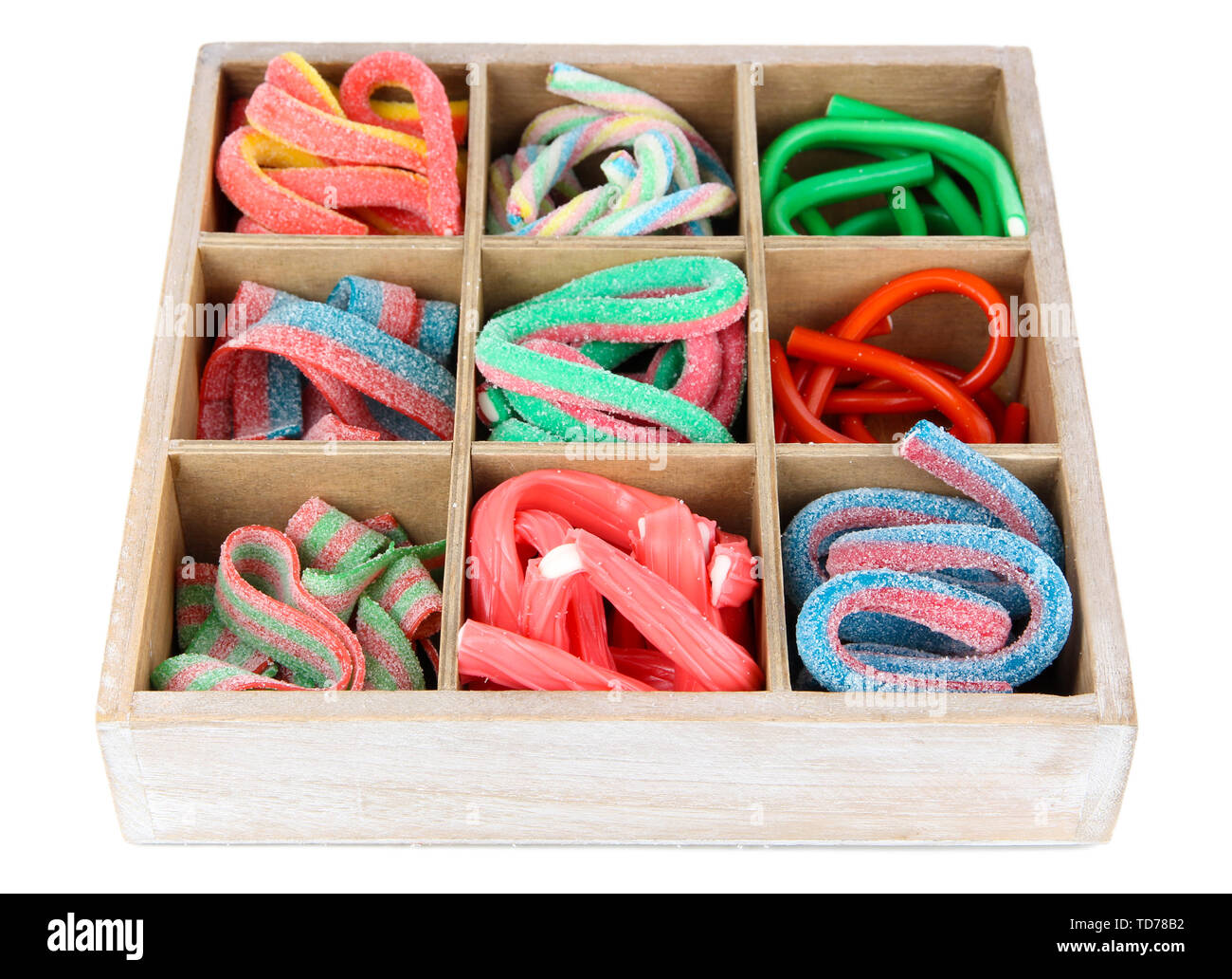 Sweet jelly candies in wooden box isolated on white Stock Photo - Alamy