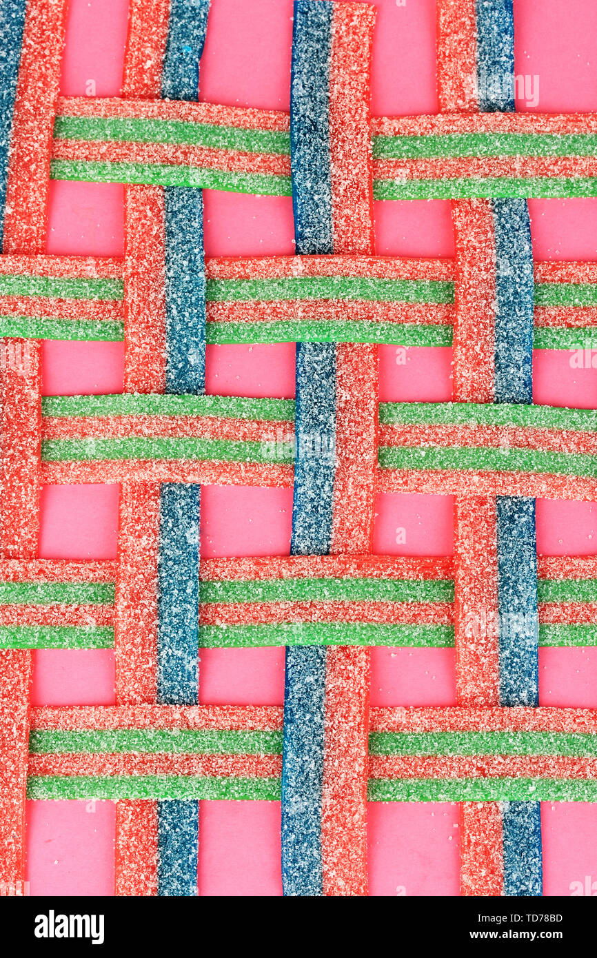 Sweet jelly candies on pink background Stock Photo - Alamy