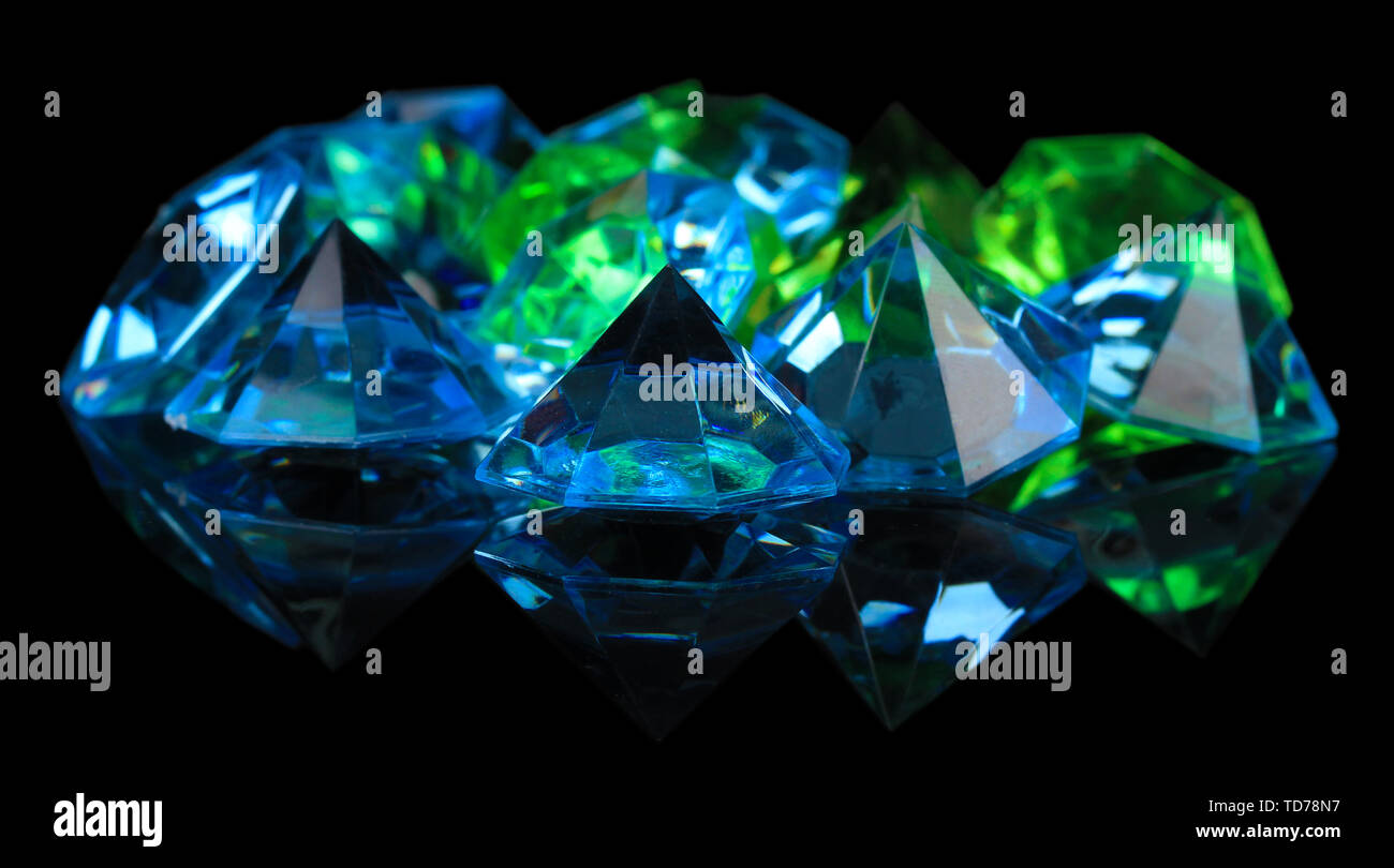 Diamonds on dark color background Stock Photo - Alamy