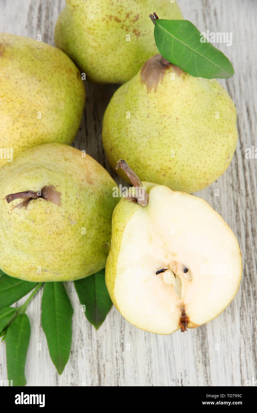 Pears on wooden background Stock Photo - Alamy