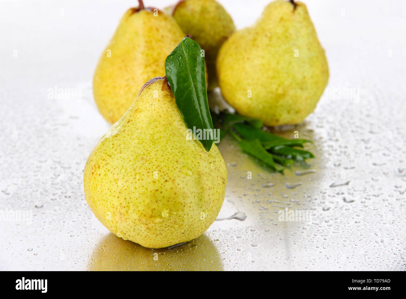 Pears on metal background Stock Photo - Alamy